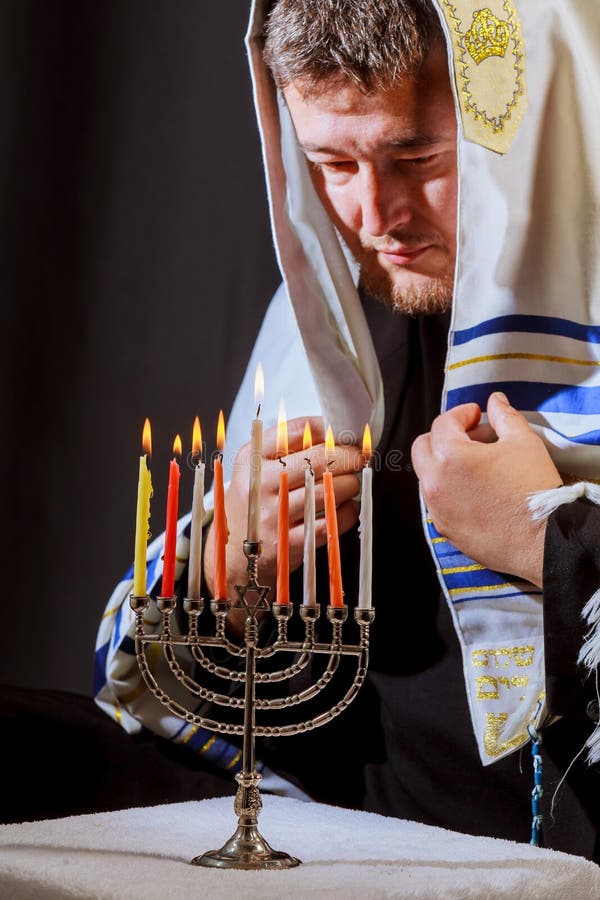 Man Hand Lighting Candles in Menorah Table Served for Hanukkah Stock ...