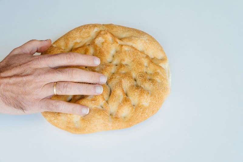 Man Hand on Loaf of Bread on White Table Stock Image - Image of baked ...