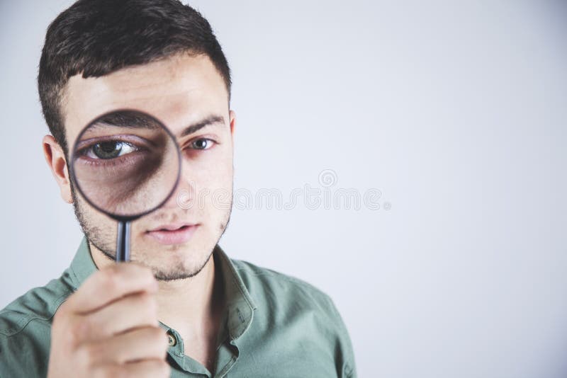 Man hand magnifier on eye stock image. Image of glass - 154114903