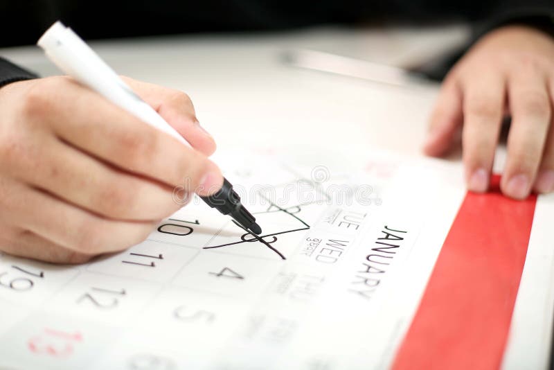 Man Hand is Marking Date on the Calendar with Marker Stock Image ...