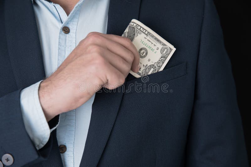 Man hand money on pocket stock photo. Image of corruption - 196975694