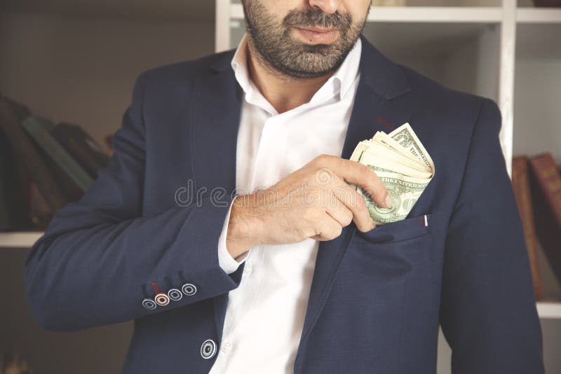 Man hand money on pocket stock photo. Image of financial - 134941636
