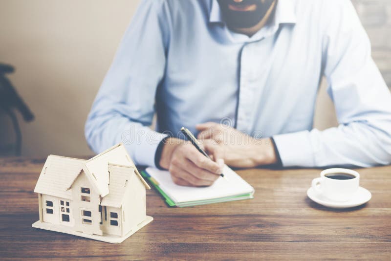 Man Hand Notepad and House Model Stock Photo - Image of message ...