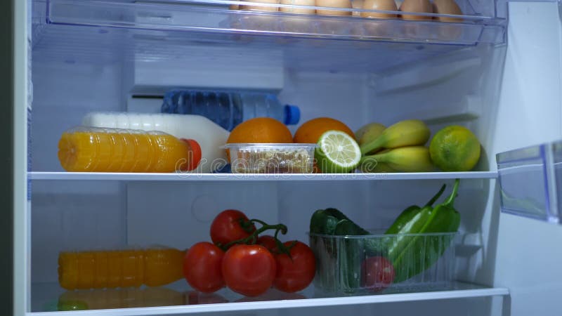 Man Hand Open Kitchen Fridge Door Looking Inside for Fresh Food and ...