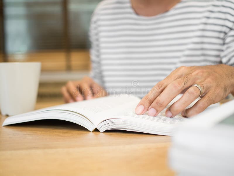 Man Hand Open and Reading a Book Stock Photo - Image of information ...