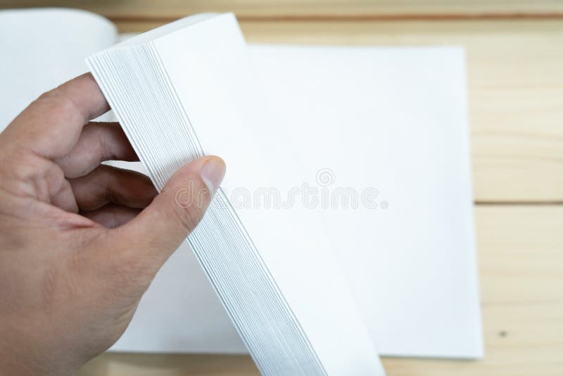 Man Hand Open the White Empty Notebook on the Wood Table Stock Photo ...