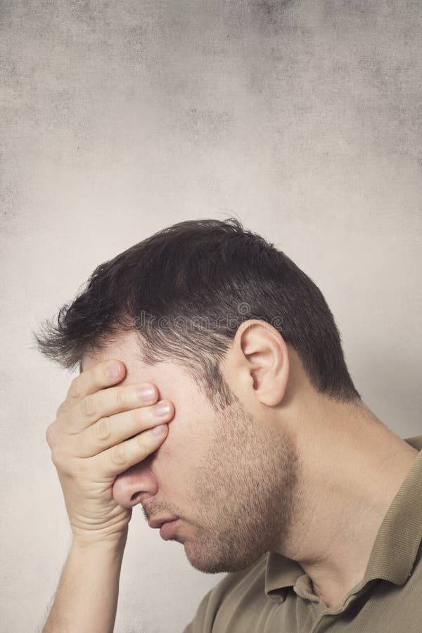 Man with hand over eyes stock image. Image of person - 50097101