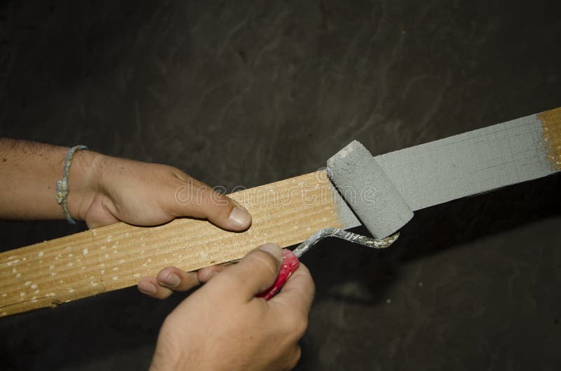 Man Hand Painting with Roller Stock Photo - Image of grunge, firewood ...