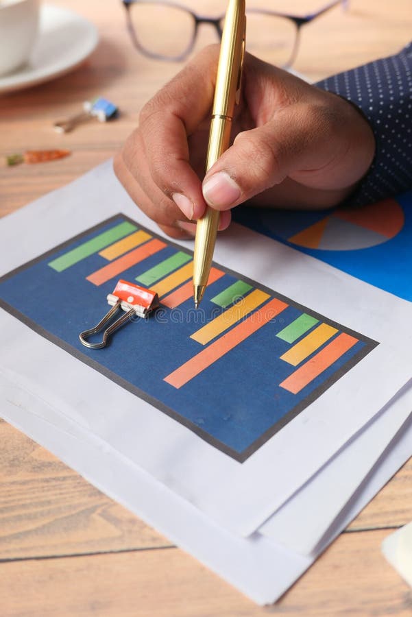 Man Hand with Pen Analyzing Bar Chart on Paper Stock Image - Image of ...