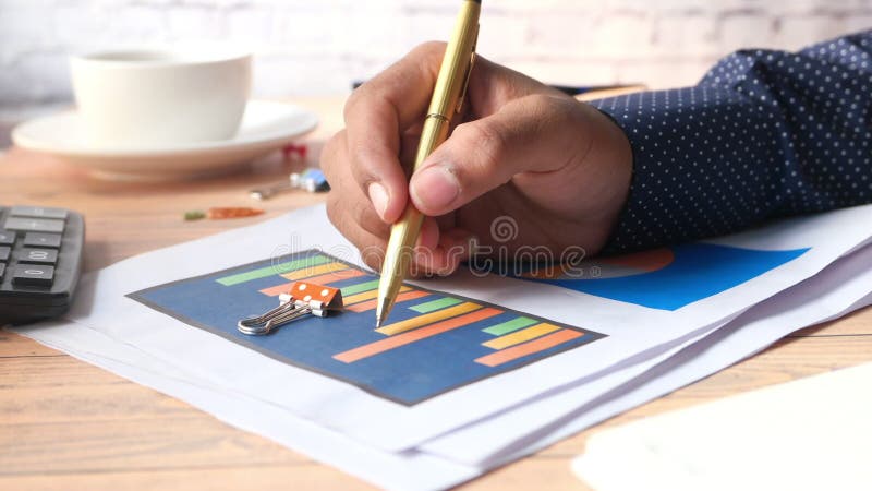 Man Hand with Pen Analyzing Bar Chart on Paper Stock Video - Video of ...