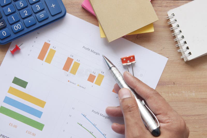 Man Hand with Pen Analyzing Bar Chart on Paper Stock Image - Image of ...