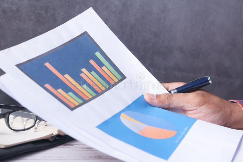 Man Hand with Pen Analyzing Bar Chart on Paper Stock Image - Image of ...