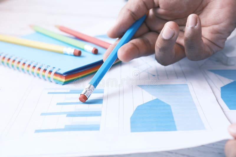 Man Hand with Pen Analyzing Bar Chart on Paper Stock Image - Image of ...