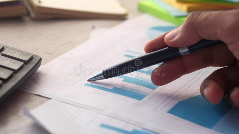 Man Hand with Pen Analyzing Bar Chart on Paper Stock Video - Video of ...