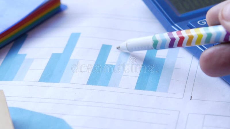 Man Hand with Pen Analyzing Bar Chart on Paper Stock Footage - Video of ...