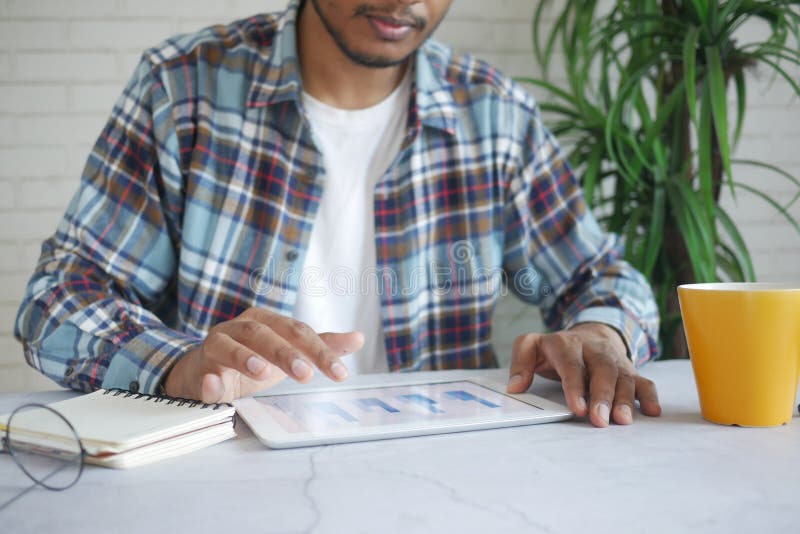 Young Man Hand with Pen Analyzing Bar Chart on Paper White Sited Stock ...