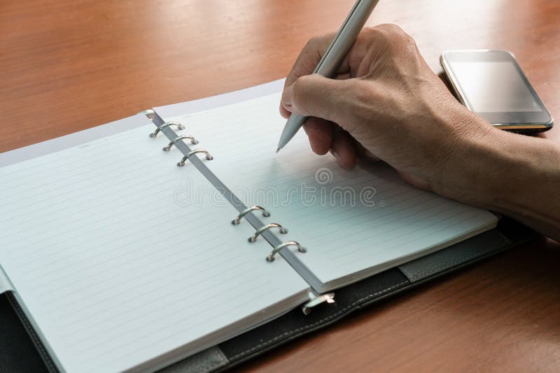 Man Hand with Pen Writing Note on Notebook at Office Stock Photo ...