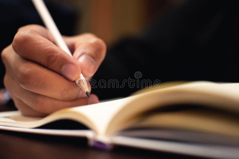 Man Hand with Pencil Writing on Notebook Stock Photo - Image of notepad ...