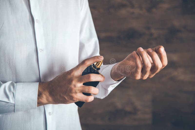 Man hand perfume on hand. stock photo. Image of liquid - 211559064
