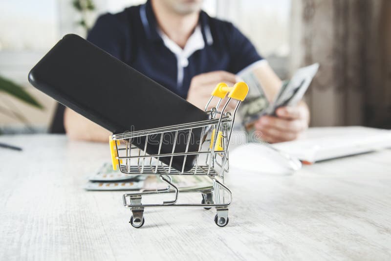 Man hand phone on basket stock photo. Image of technology - 145327416