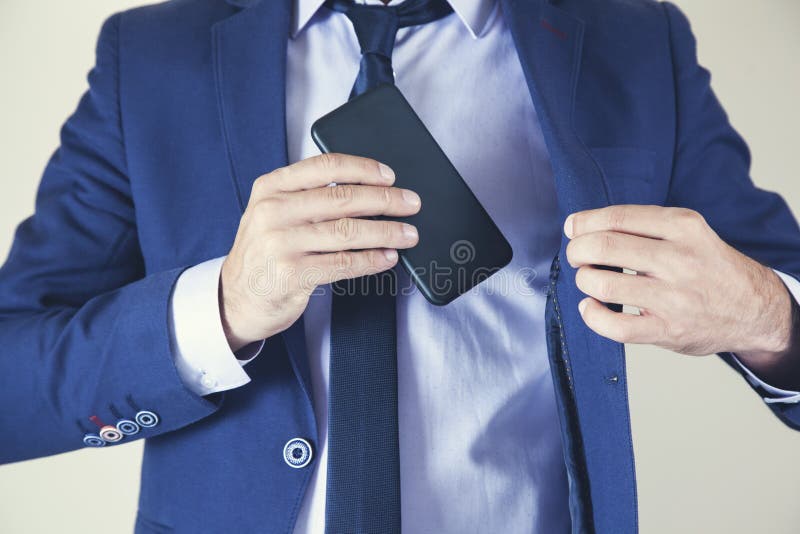 Man hand phone in pocket stock image. Image of pocket - 161596789