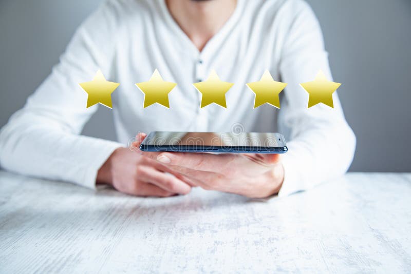 Man hand phone with stars stock image. Image of concept - 206570287