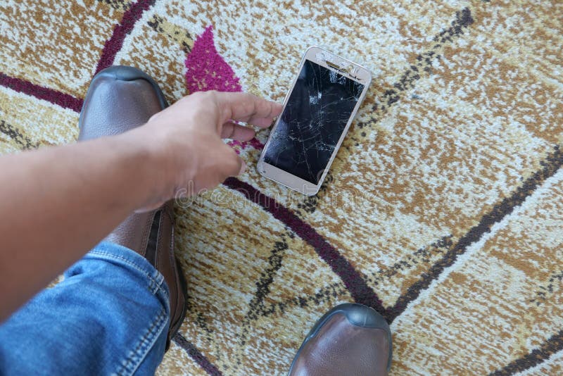 Man Hand Picking Broken Smart Phone from Floor Stock Photo - Image of ...