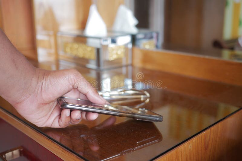 Man Hand Picking Up Smart Phone Mobile To Receive a Call Stock Photo ...