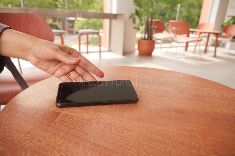 Man Hand Picking Up Smart Phone Mobile To Receive a Call Stock Photo ...