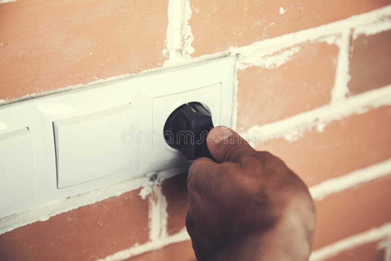 Man hand plug stock photo. Image of technology, outlet - 152956128
