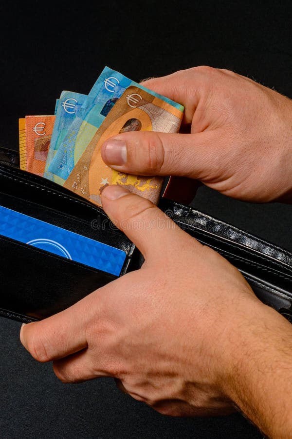 Man Hand Pulling Money from Wallet, Black Background and Black Wallet ...