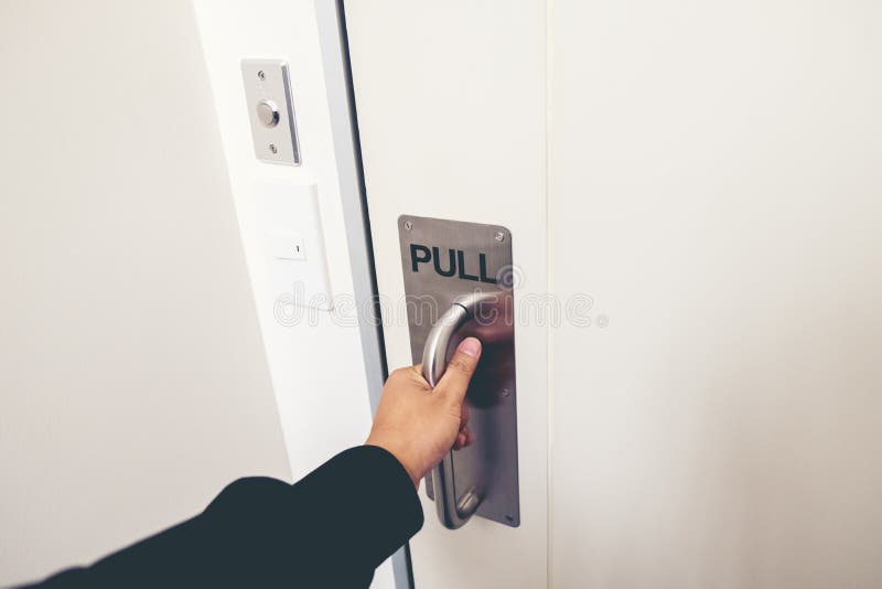Man Hand Pulling Rusty Metal Handle Outside a Office Stock Photo ...
