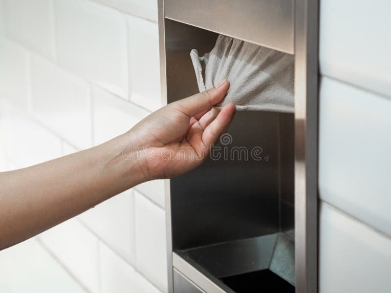Man Hand Pulling a Tissue Paper from Tissue Box in the Restroom. Stock ...