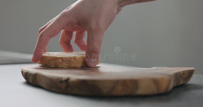 Man Hand Put Ciabatta Slice on Olive Board Stock Photo - Image of ...