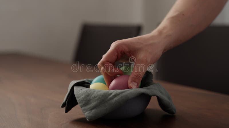 Man Hand Put Easter Egg in a Bowl on Walnut Table Stock Photo - Image ...