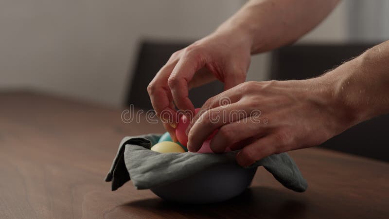 Man Hand Put Easter Egg in a Bowl on Walnut Table Stock Photo - Image ...