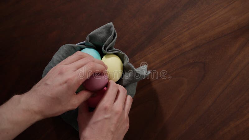 Man Hand Put Easter Egg in a Bowl on Walnut Table Stock Photo - Image ...