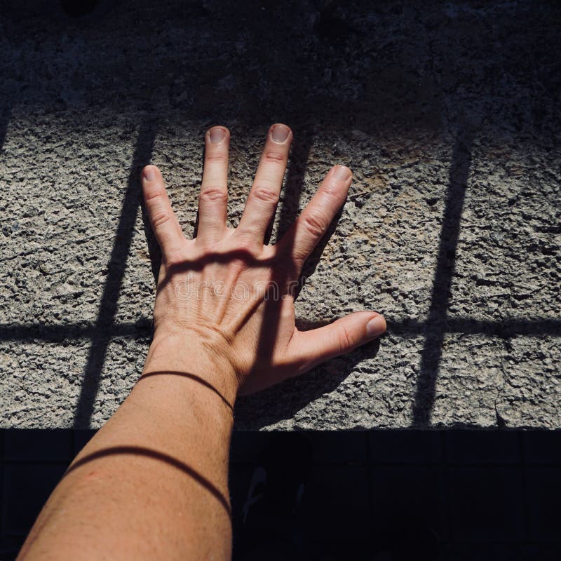 Man hand shadow silhouette stock photo. Image of symbol - 152464880