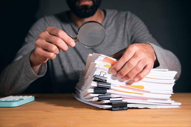 Man Hand Stack of Paper and Magnifier Stock Photo - Image of document ...