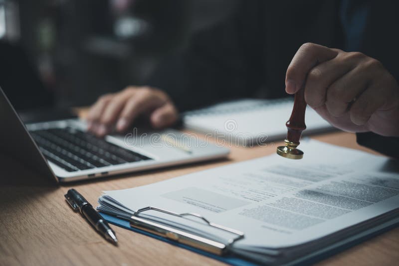 Man Hand Stamping Approval Signing on Document or Paperwork Contract at ...