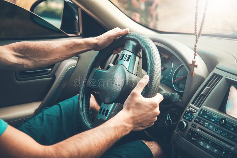 Man`s Hand on the Steering Wheel Inside of a Car Stock Image - Image of ...