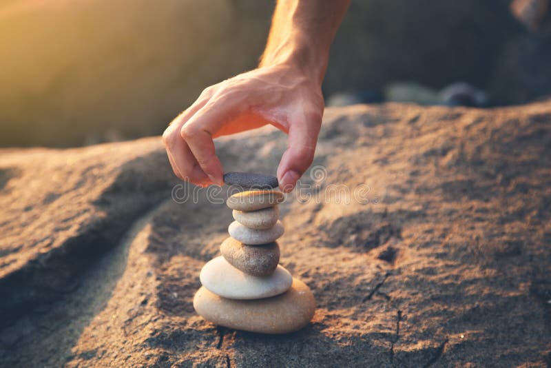 Man Hand Stone Tower on the Beach. Stock Image - Image of white, rock ...