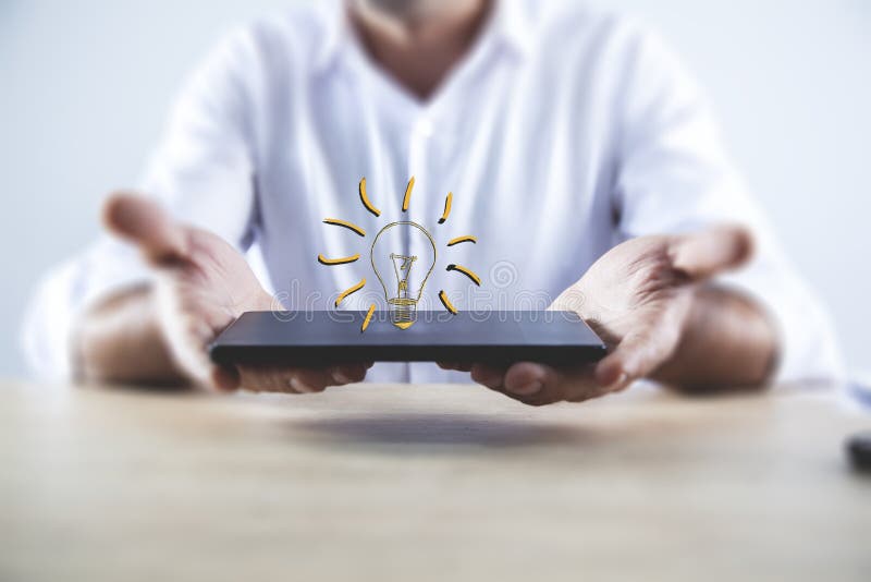 Man Hand Tablet with Light Bulb Stock Image - Image of business, media ...