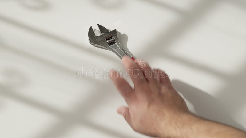 Man Hand Take Adjustable Wrench from White Background on Floor. Concept ...