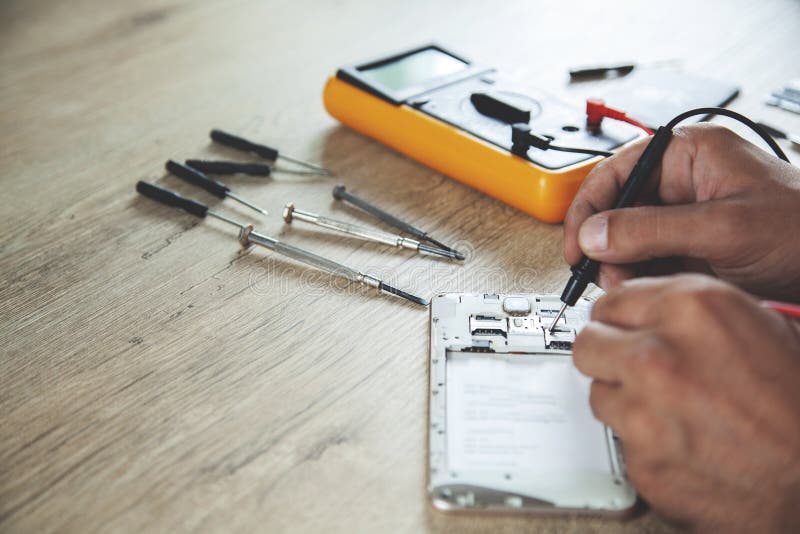 Man hand tester and phone stock image. Image of cellphone - 157516563