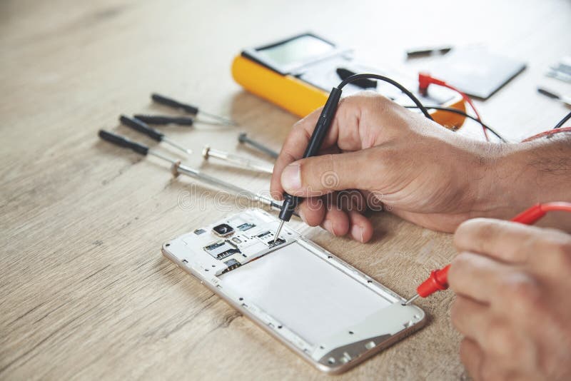 Man hand tester and phone stock photo. Image of expertise - 157516652