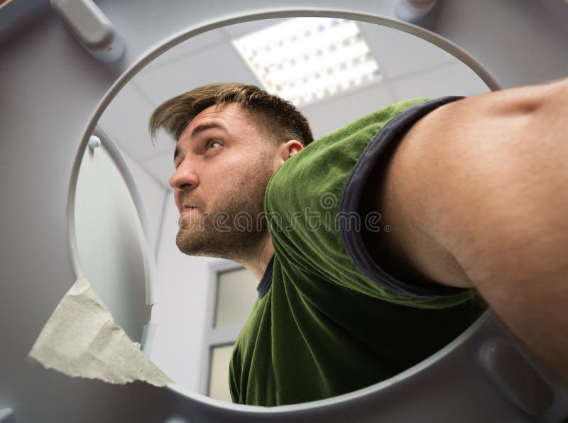 Man with Hand in the Toilet Stock Image - Image of toilet, look: 71812247