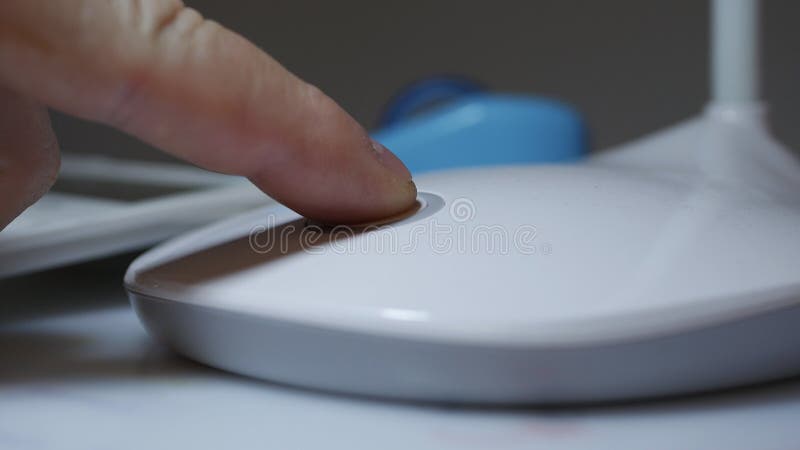 Man Hand Touching with a Finger Lamp Button and Starting the Desk Lamp ...