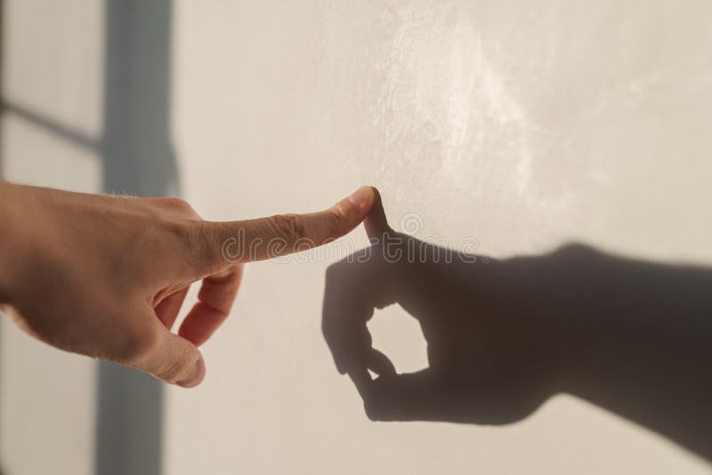 Man Hand Touching the Wall with Long Shadow Stock Photo - Image of ...