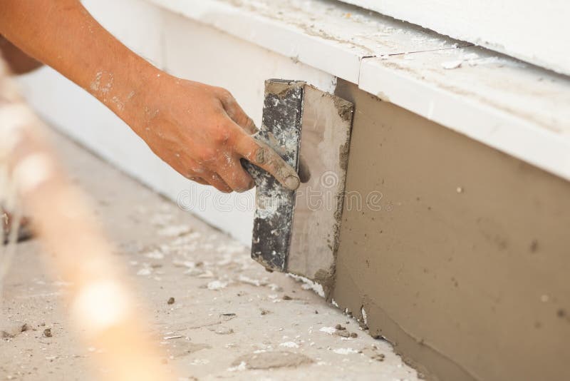 Man Hand with Trowel Plastering a Foundation of House Stock Image ...